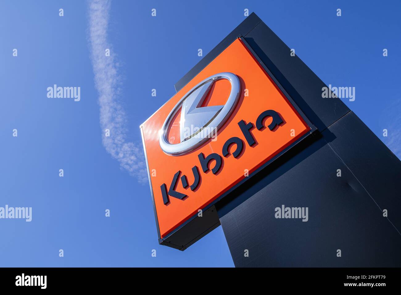 Kubota dealership sign against blue sky Stock Photo - Alamy