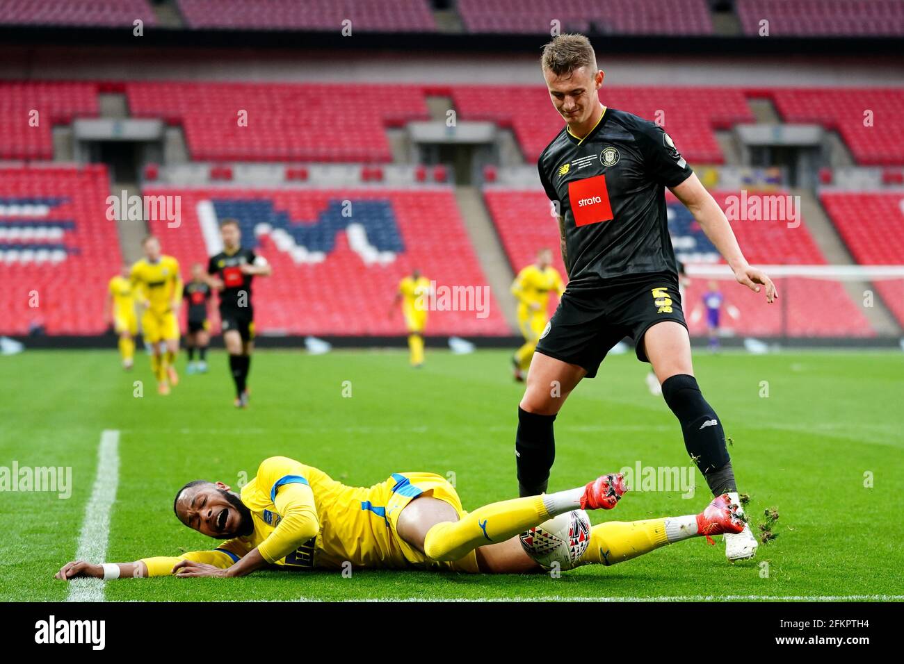 Concord Rangers' Lamar Reynolds (left) reacts to a challenge by ...