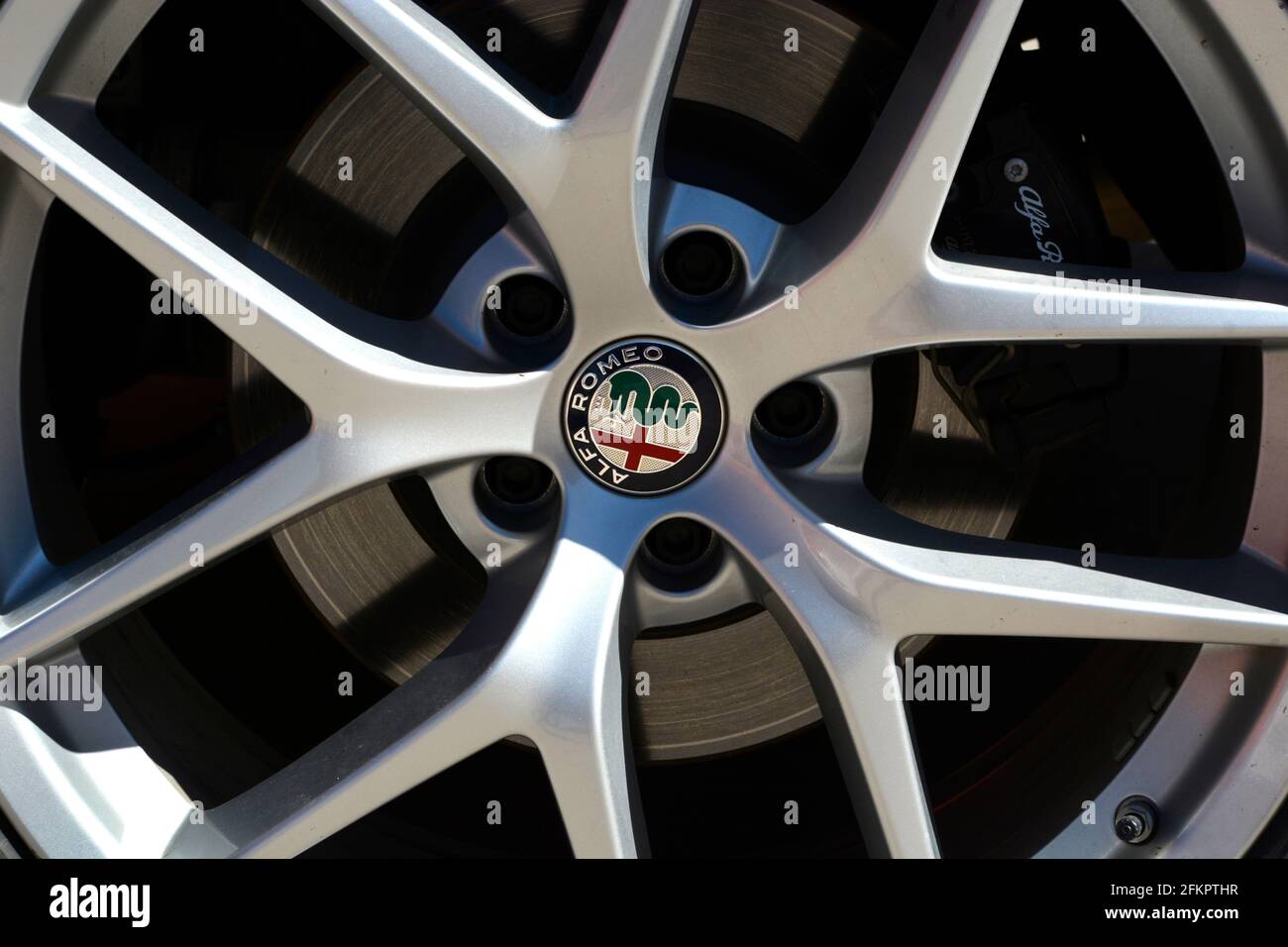 The Alfa Romeo logo on the wheel cover of an Alfa Romeo SUV in Santa Fe ...