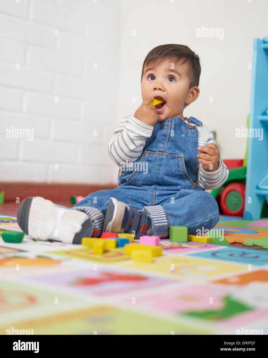 Baby playing in house Stock Photo - Alamy