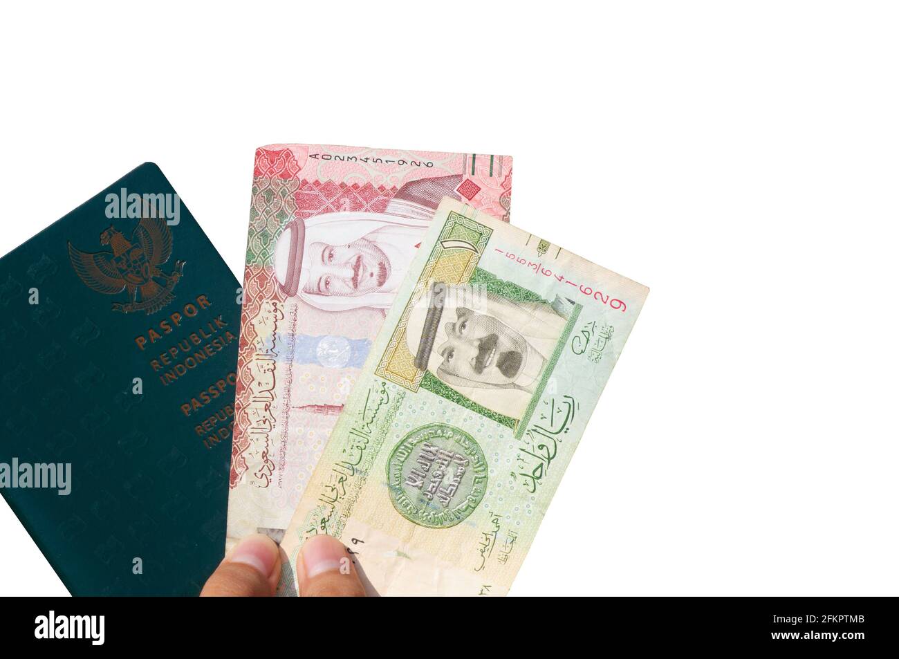 Indonesian green passport book and The Saudi Riyal, the currency of ...