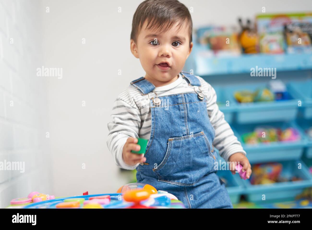 Baby playing in house Stock Photo - Alamy