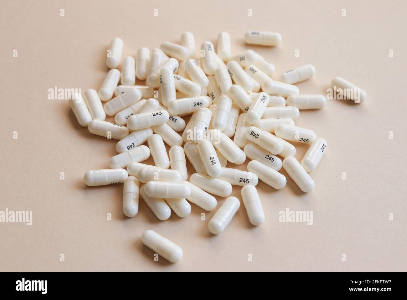 Kuwait City - Kuwait - May 3, 2021: White pills on cream background ...