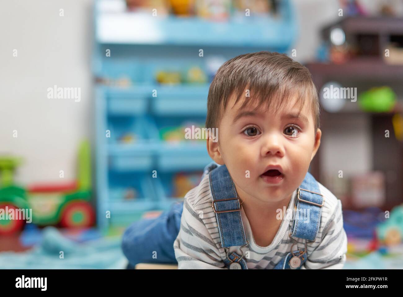 Baby playing in house Stock Photo - Alamy