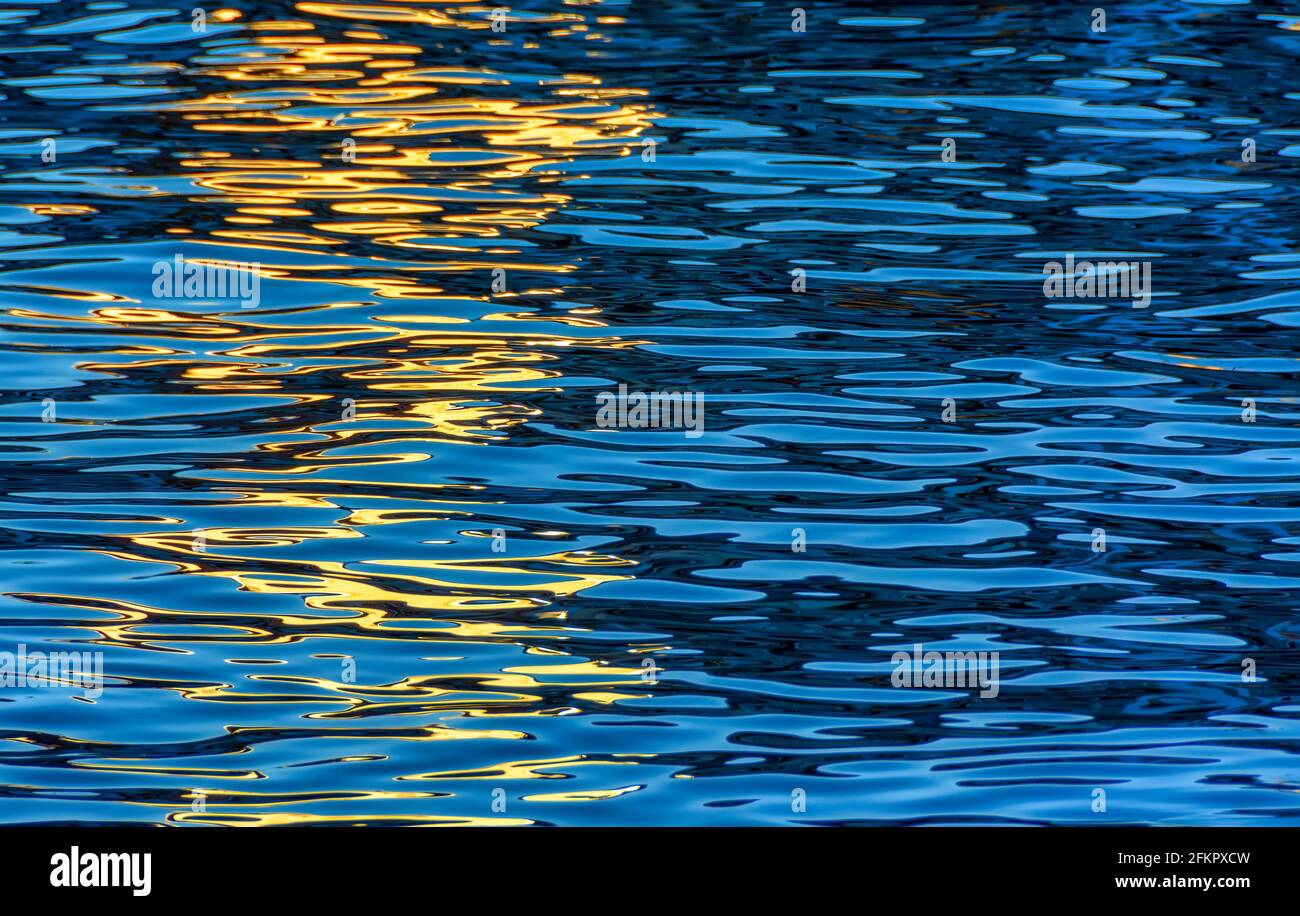 Evening river water texture with light reflection from a lantern Stock ...