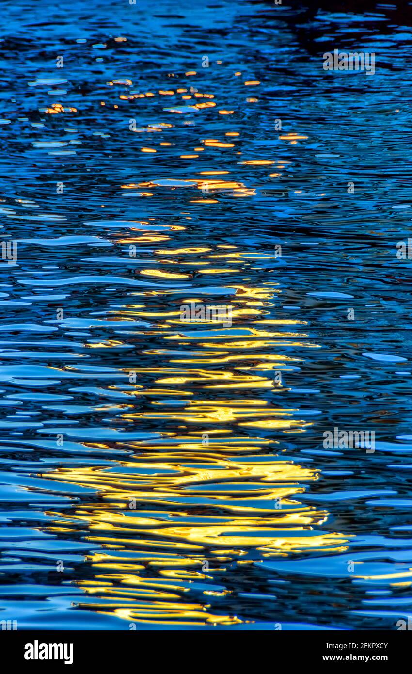 Evening river water texture with light reflection from a lantern Stock ...