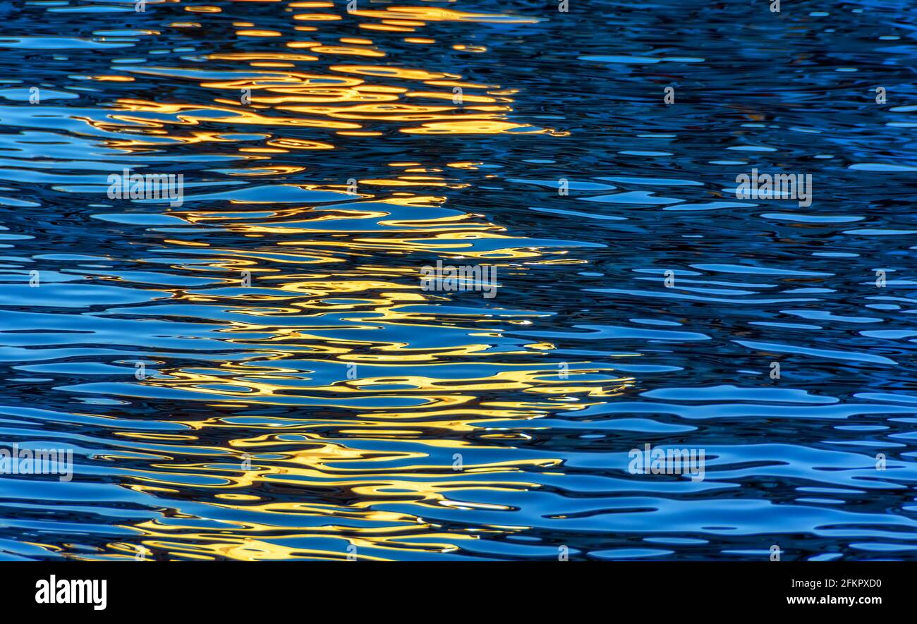 Evening river water texture with light reflection from a lantern Stock ...