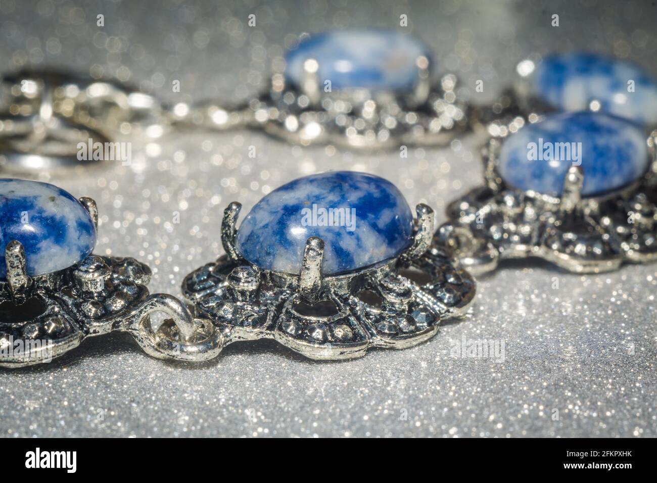 Decorative silver bracelet with sodalite, blue white spotted stone ...