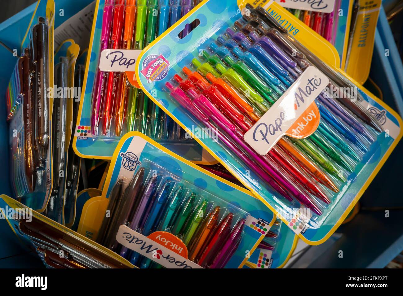 Packages of Newell BrandsÕ Paper Mate pens are seen in the back to ...