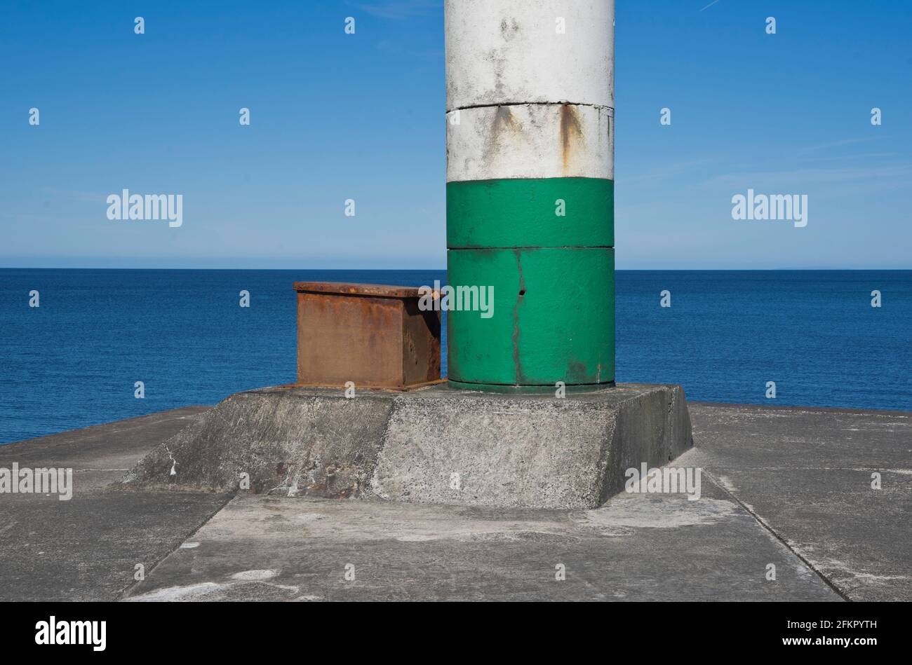 Around the lighthouse by the sea at the harbour in Aberystwyth ...