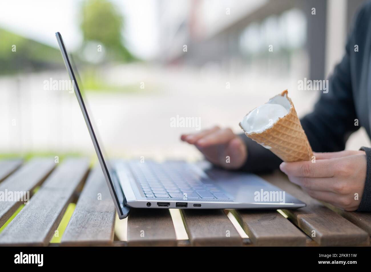 Close-up of the hands of a business woman on a laptop keyboard on a ...