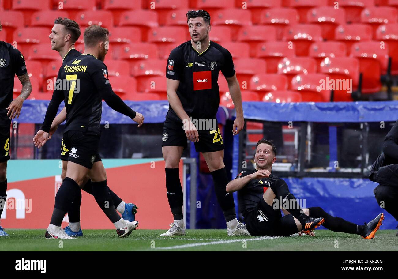 London, England, 3rd May 2021. Josh Falkingham (R) of Harrogate Town ...