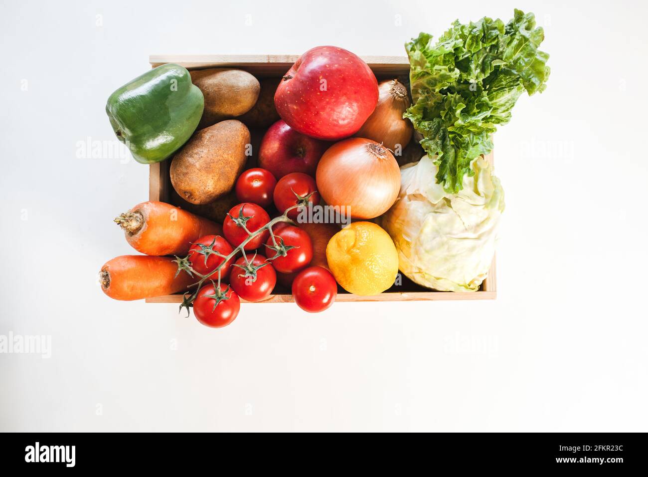 Fresh produce donation box on white background Stock Photo - Alamy