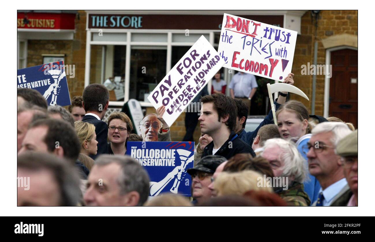 A poster of Michael Howard seen through a crowd on his visits to ...