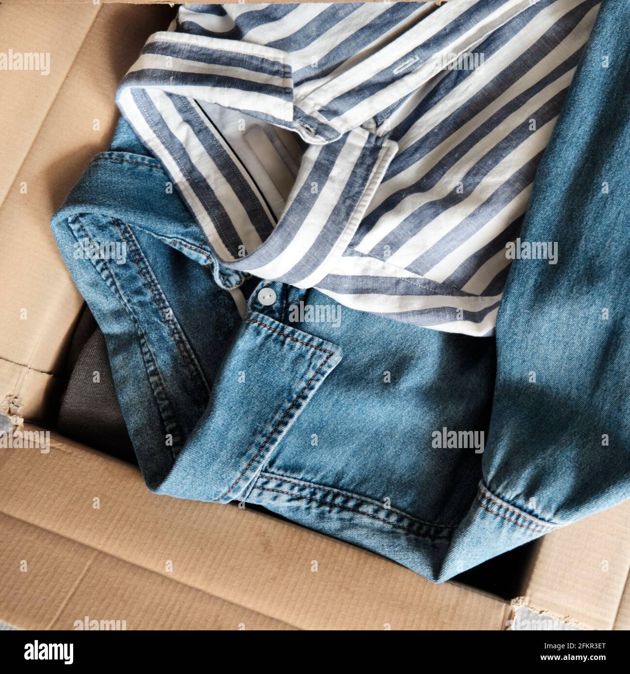 Card box with clothes inside. Donation Concept or Second hand Stock ...