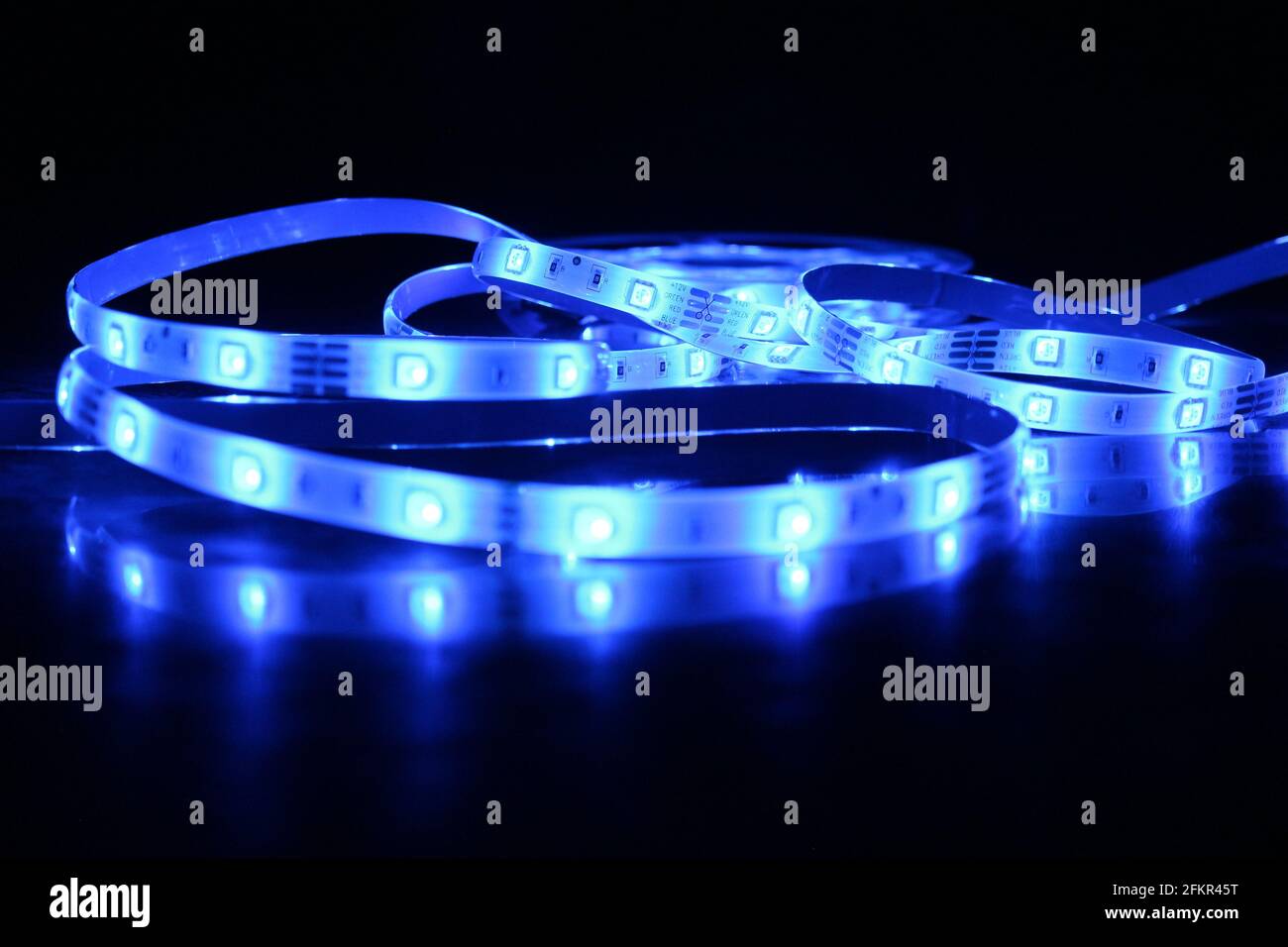 Led strip in operation generating suggestive luminous and colored ...