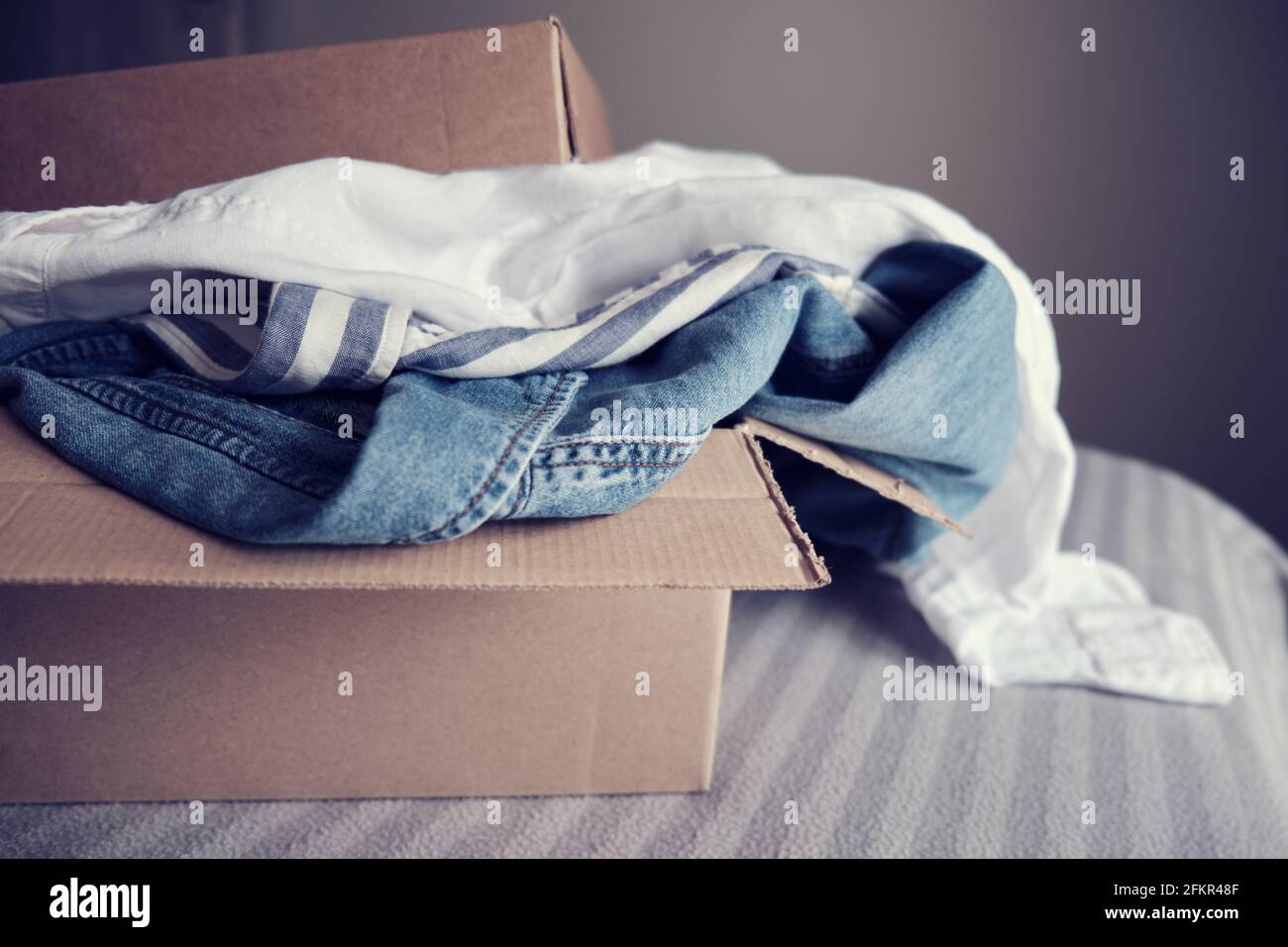 Card box with clothes inside. Donation Concept or Second hand Stock ...