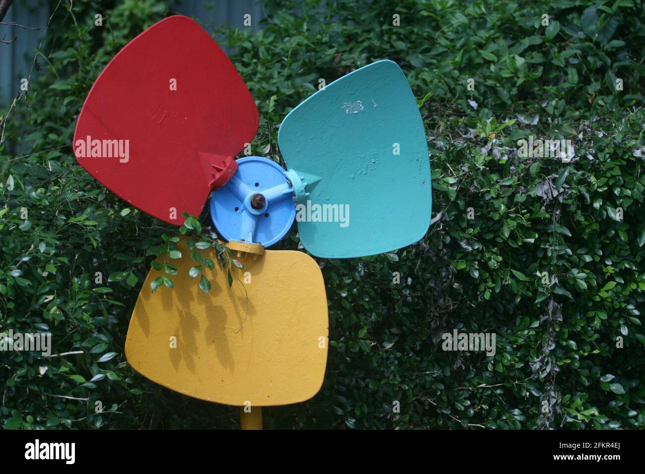 Colorful propeller for wind in the garden Stock Photo - Alamy