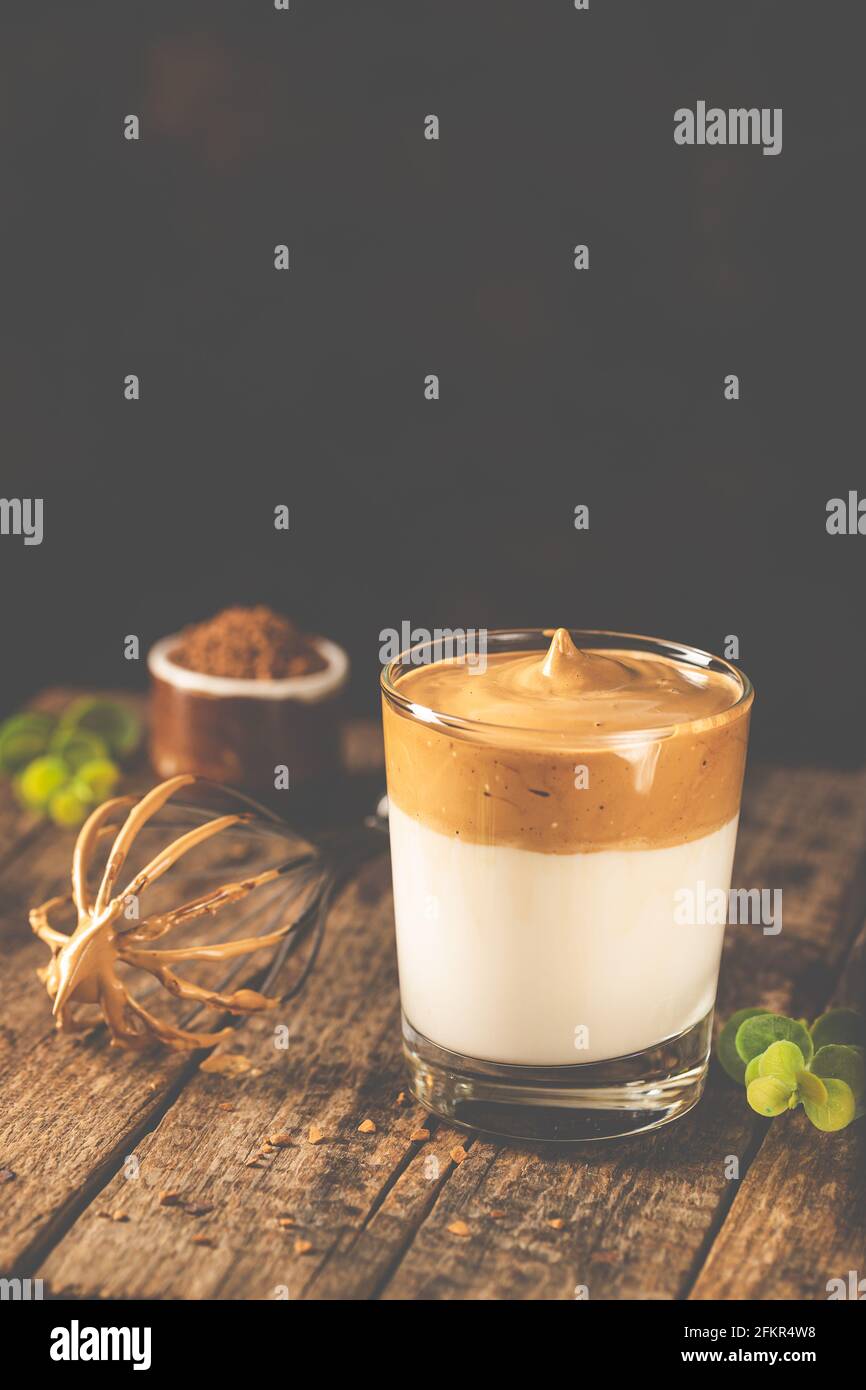 Dalgona Coffee, a cool fluffy whipped coffee in a glass. Latte espresso ...