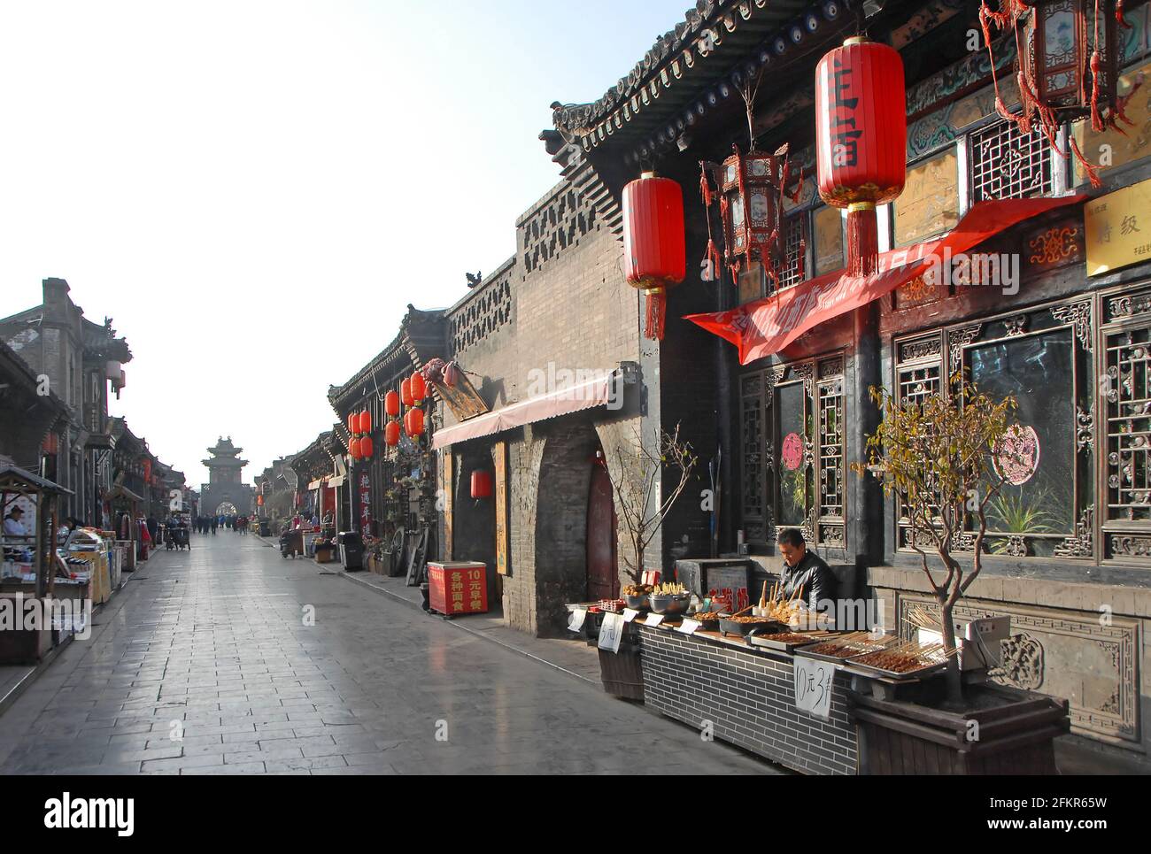 Pingyao in Shanxi Province, China: A vendor selling street food in ...