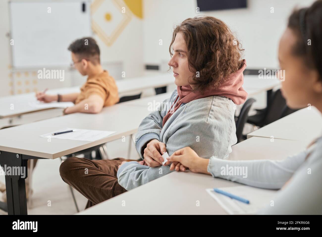 Passing note in class hi-res stock photography and images - Alamy