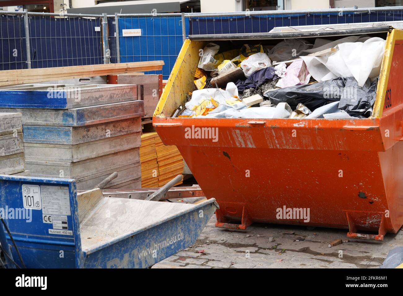 Construction debris in industrial container on a construction site with ...