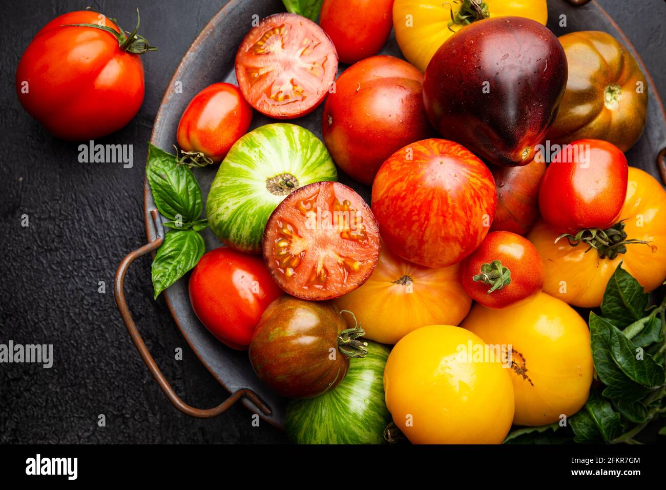 Mixed tomatoes top view. Composition with variety of colorful fresh ...