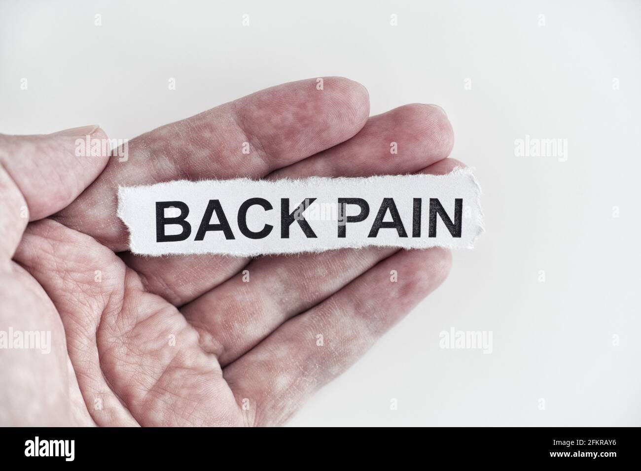 Hand on back close up hi-res stock photography and images - Alamy