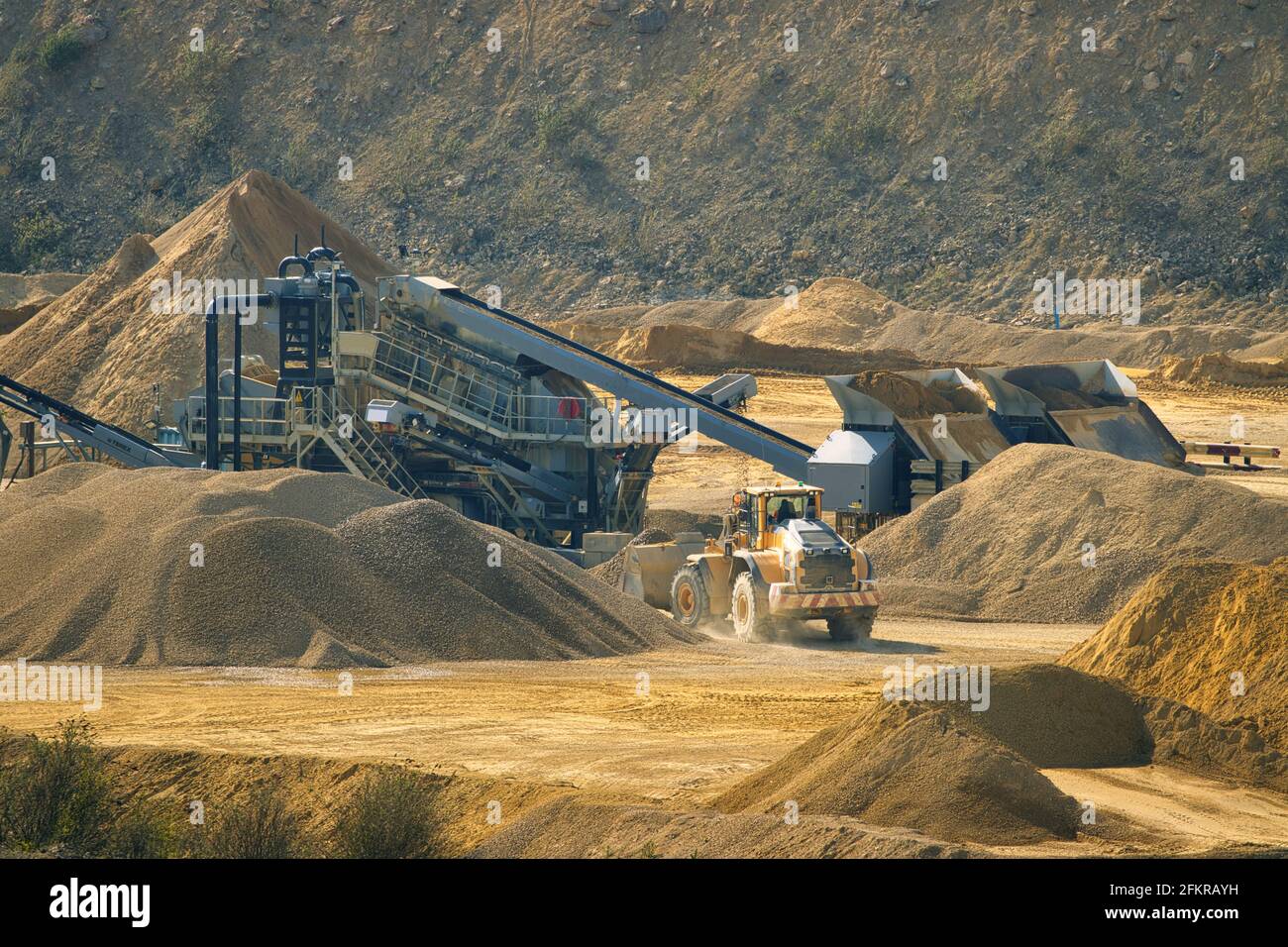 A Large Wheel Loader working in a Huge Quarry. England, UK Stock Photo ...