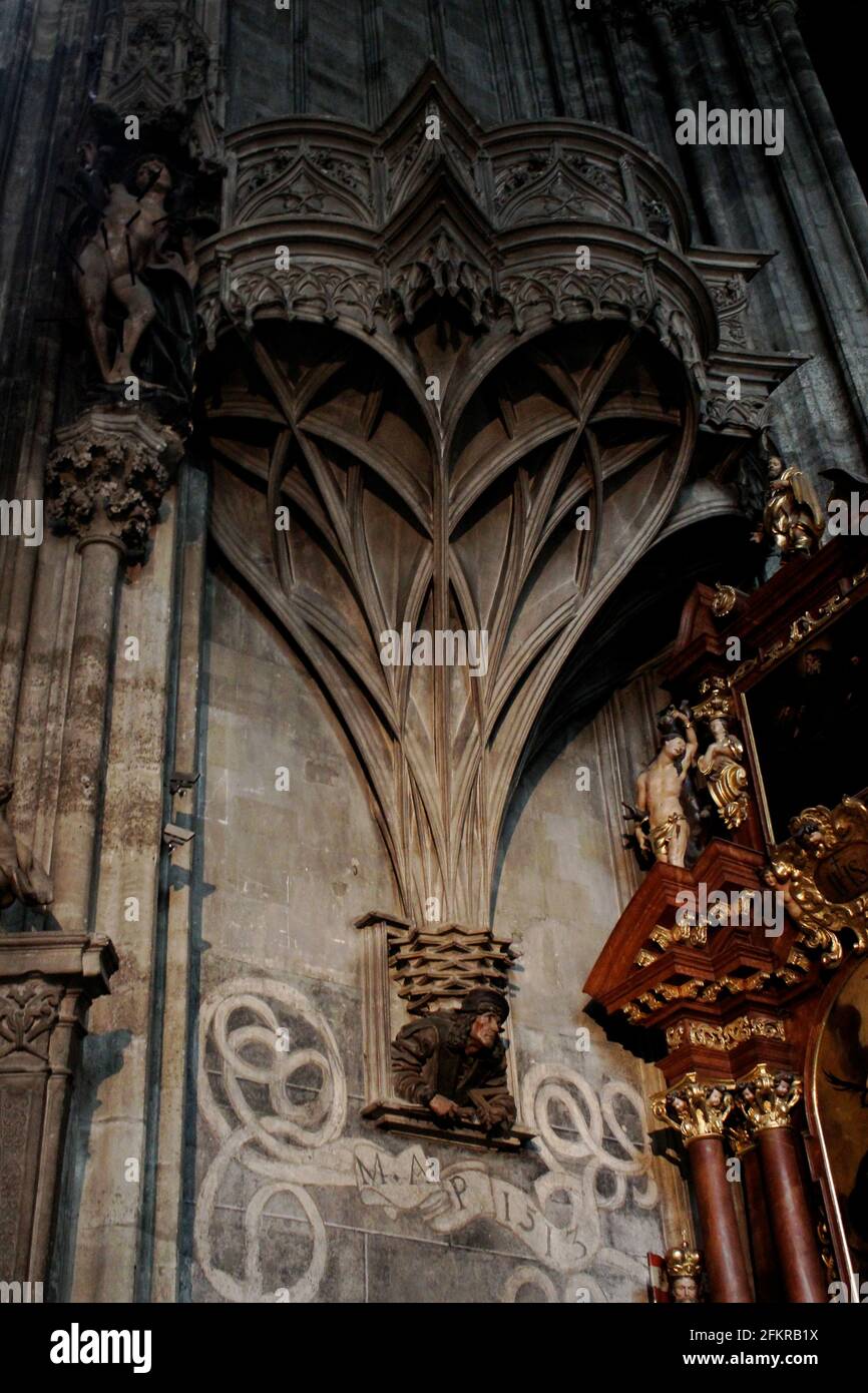 Interior Detail of sculpted carvings on wall of dimly lit church Stock ...
