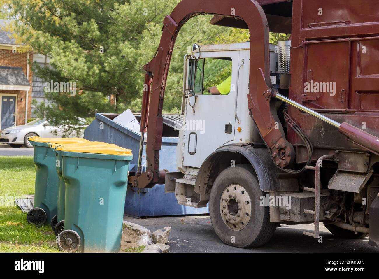 Red refuse garbage truck bin hi-res stock photography and images - Alamy