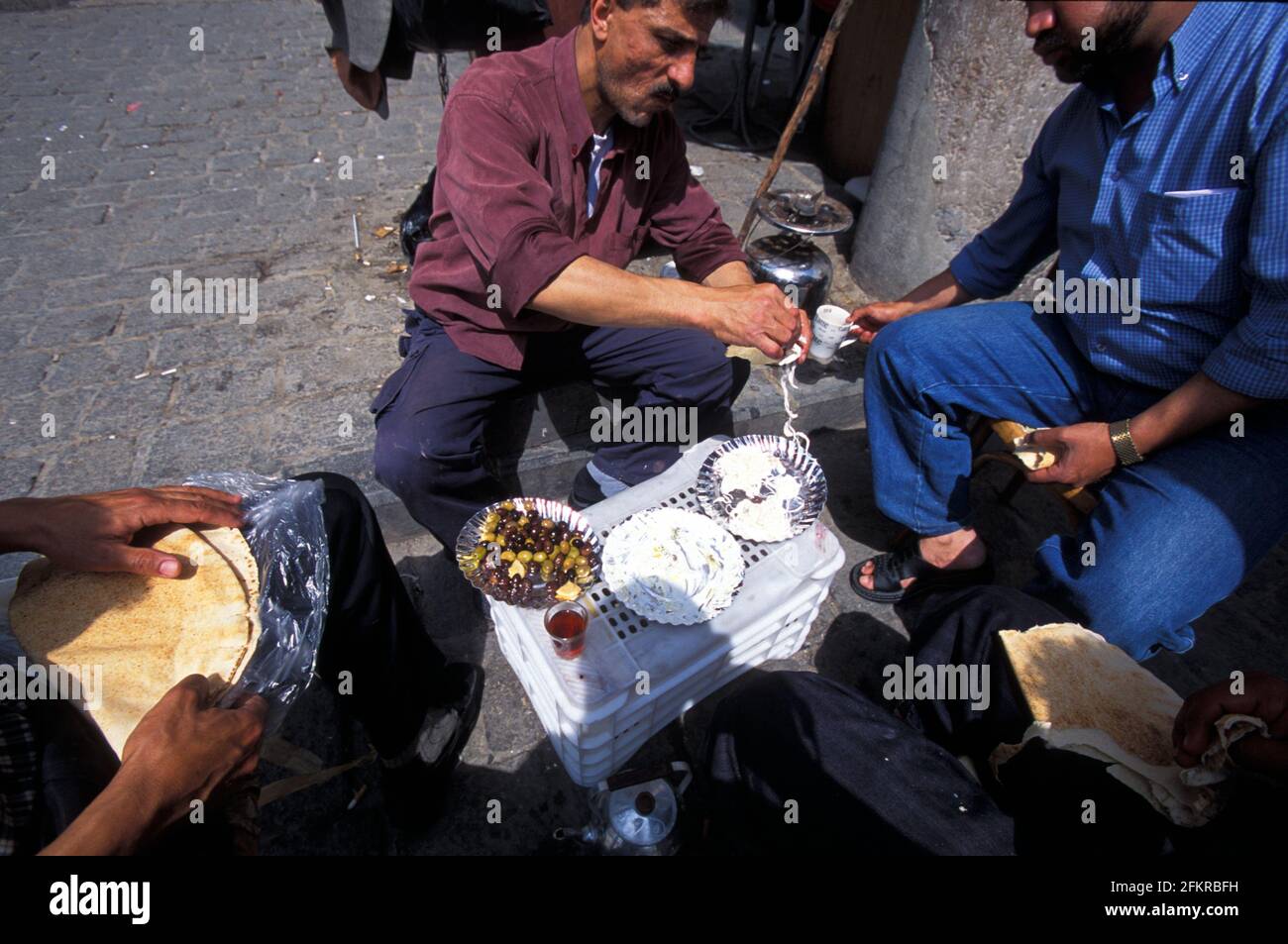 Eating a preparing a meal in a street in Damascus, Syria Stock Photo ...