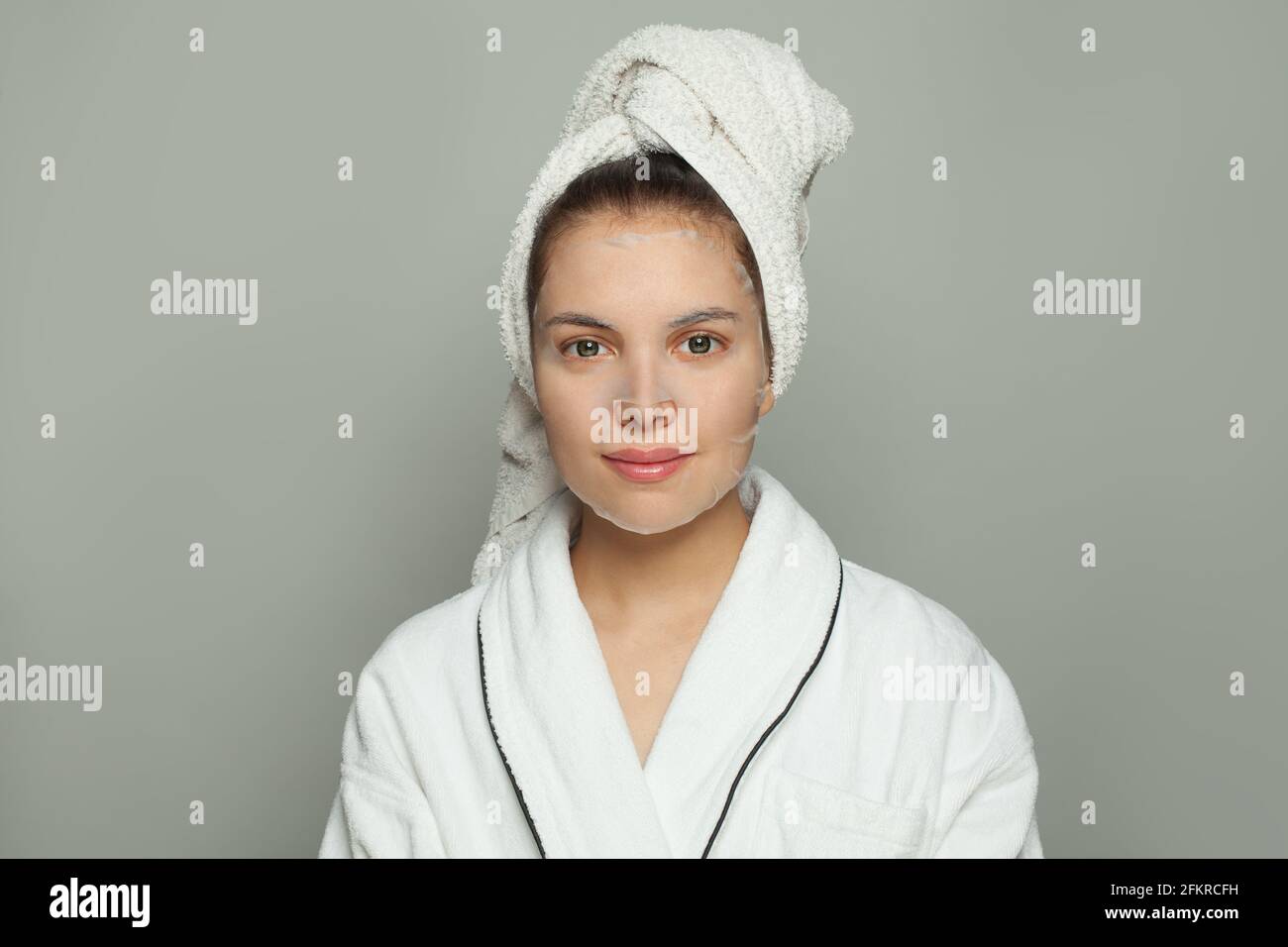 Spa model woman in cosmetic tissue fabric textile face mask. Facial ...