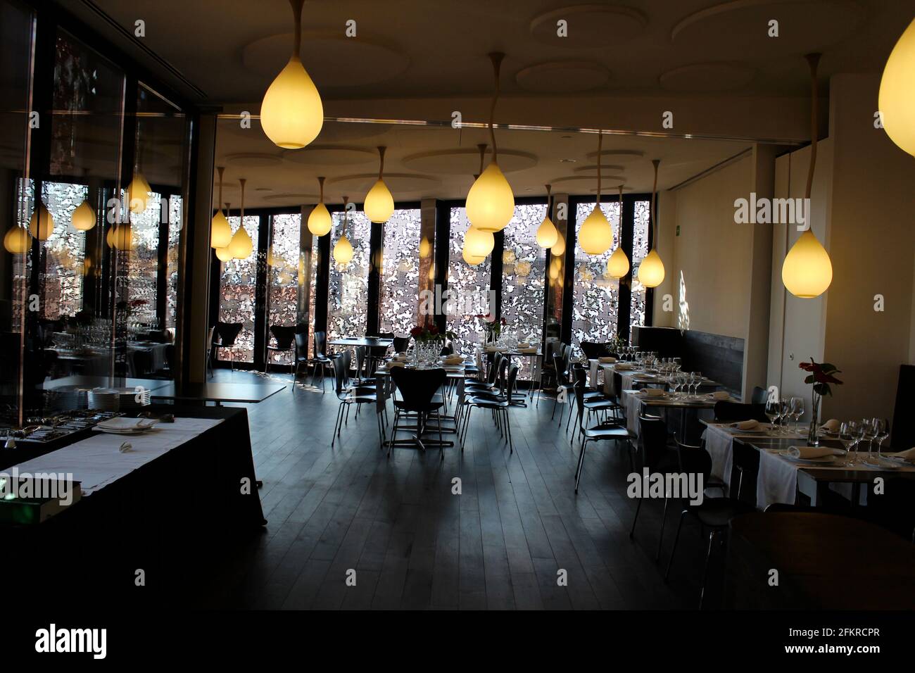 Interior of museum cafe with pixelated facade showing through windows ...