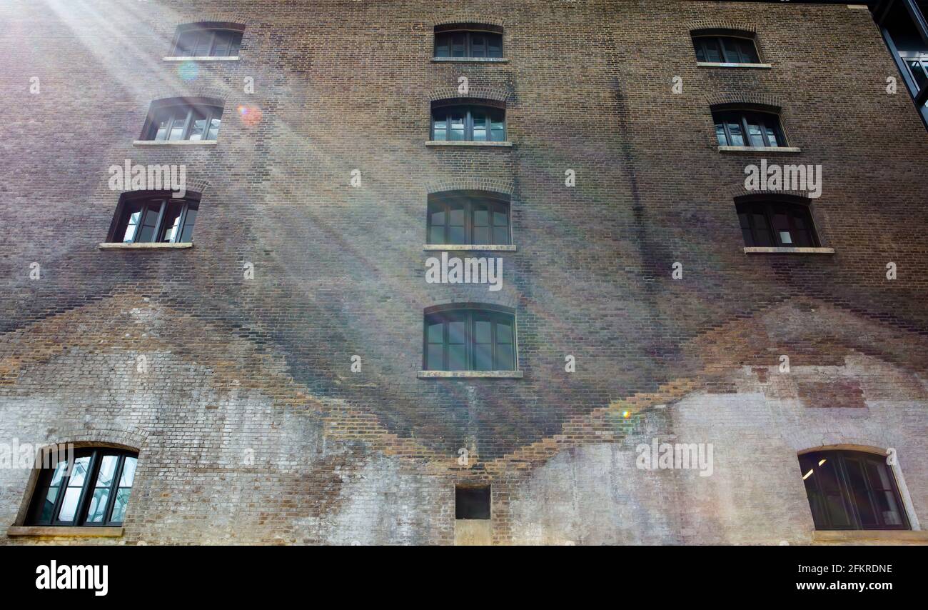 Brick facade with sun rays Stock Photo - Alamy