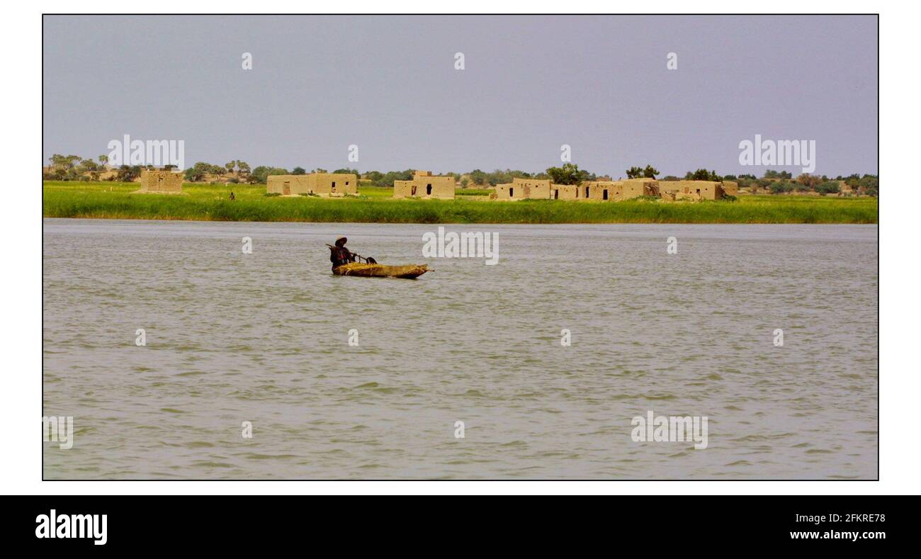 The mighty Niger river runs through the Sahara deser near Timbuktu in ...