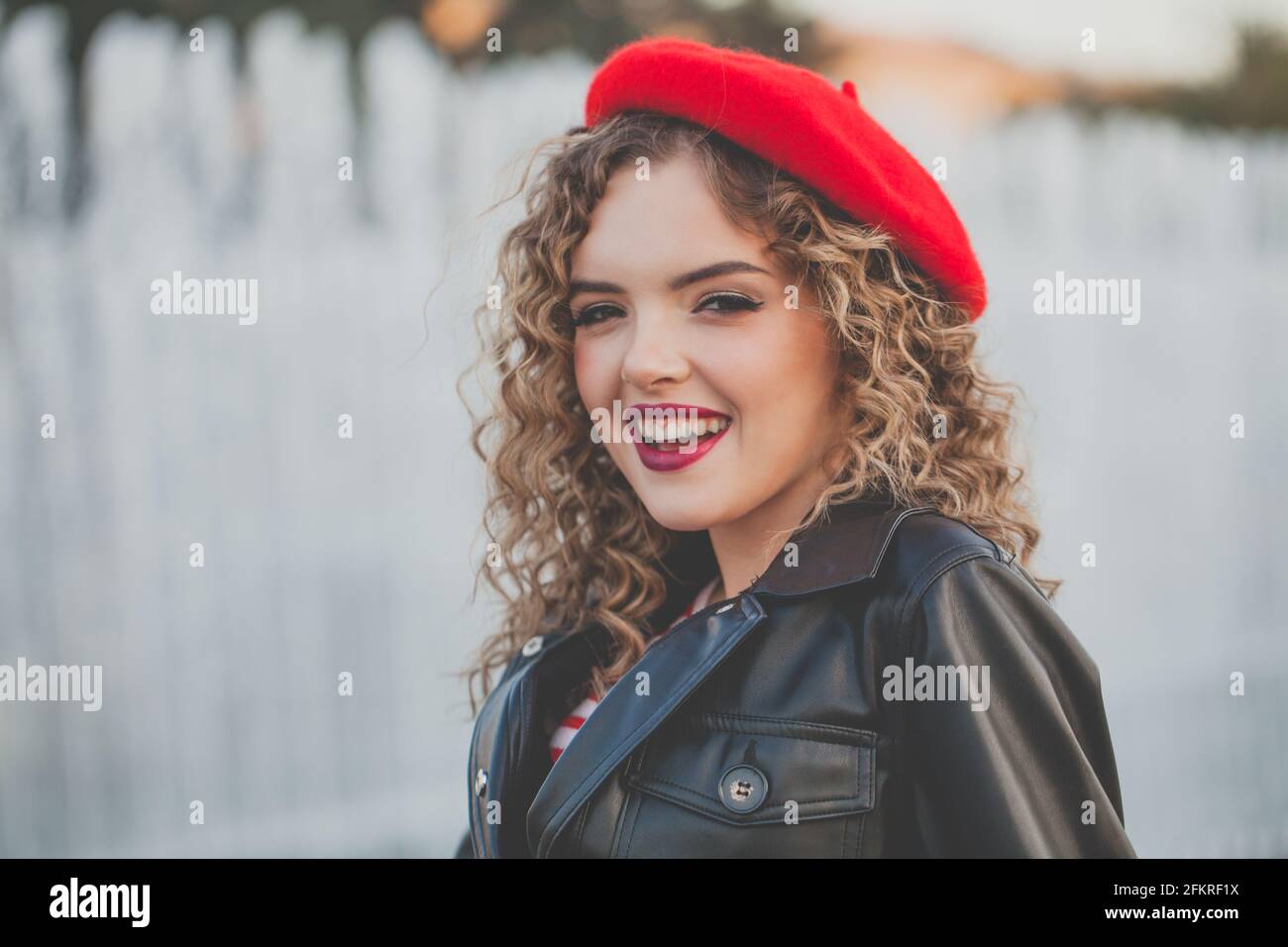 Portrait of happy woman in red beret outdoor Stock Photo - Alamy