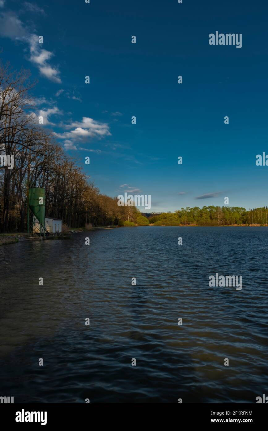 Nadeje pond near Hluboka nad Vltavou town in spring color dark blue ...