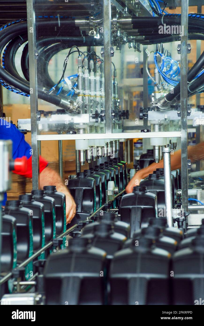 The bottles are transferred on the conveyor belt system. Industrial ...