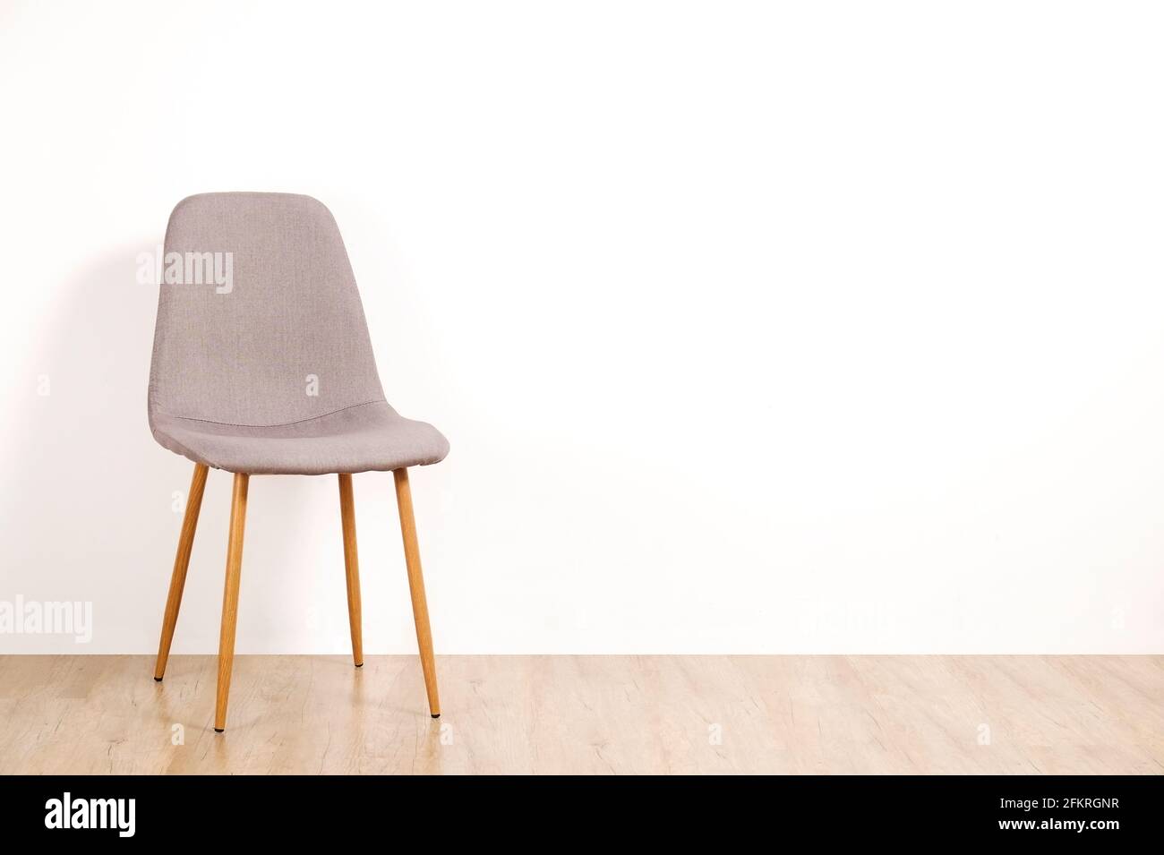 Single elegant gray loft style chair standing alone on wooden floor in ...