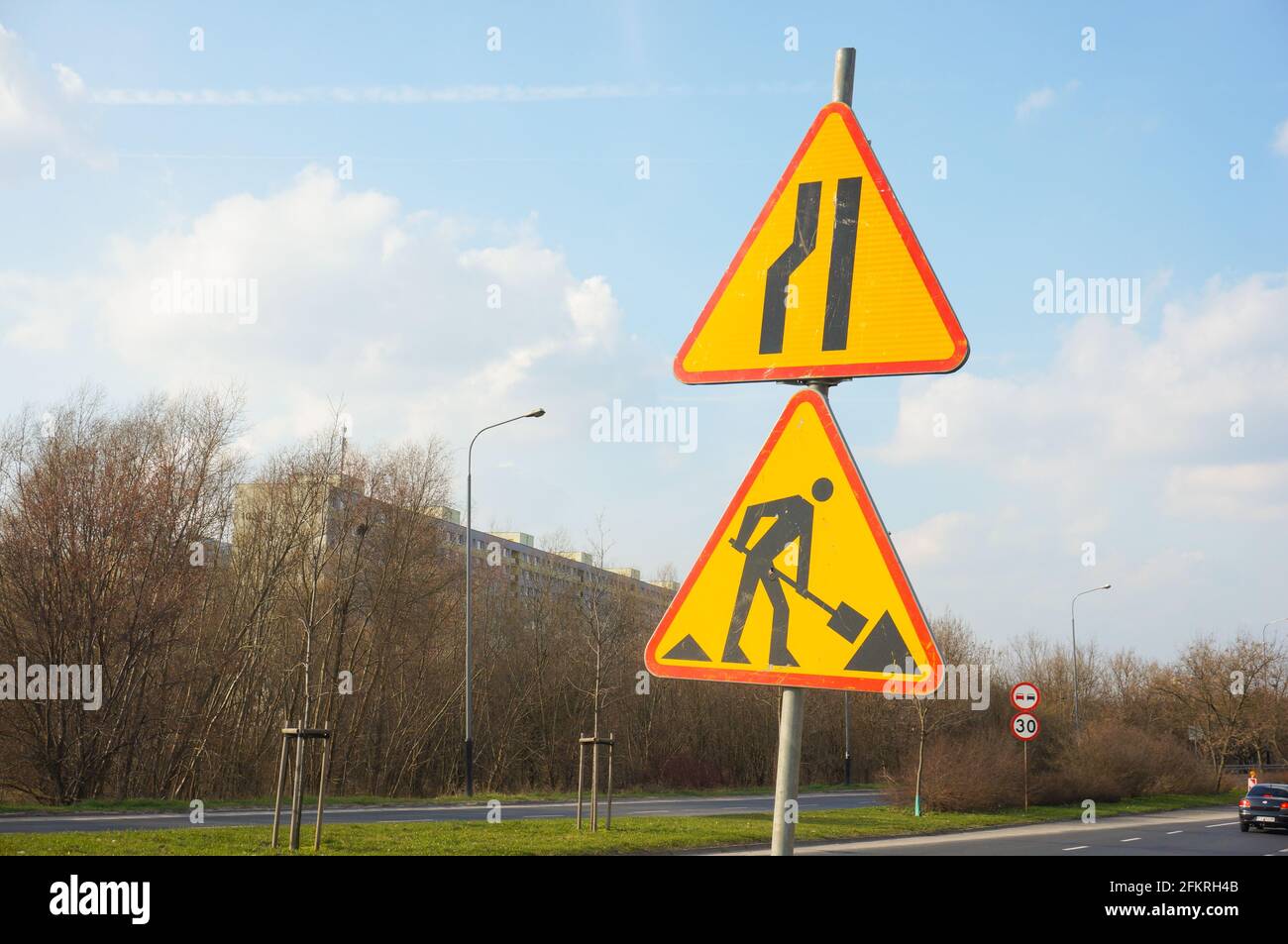 POZNAN, POLAND - Apr 06, 2016: Two traffic signs warning for road works ...