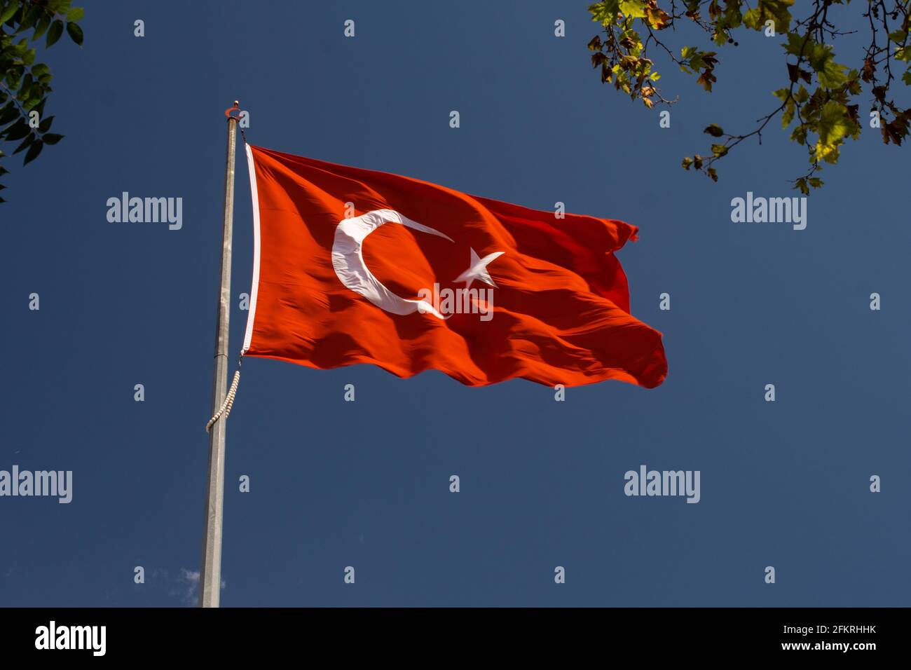 Turkish national flag with white star and moon on a pole in sky Stock ...