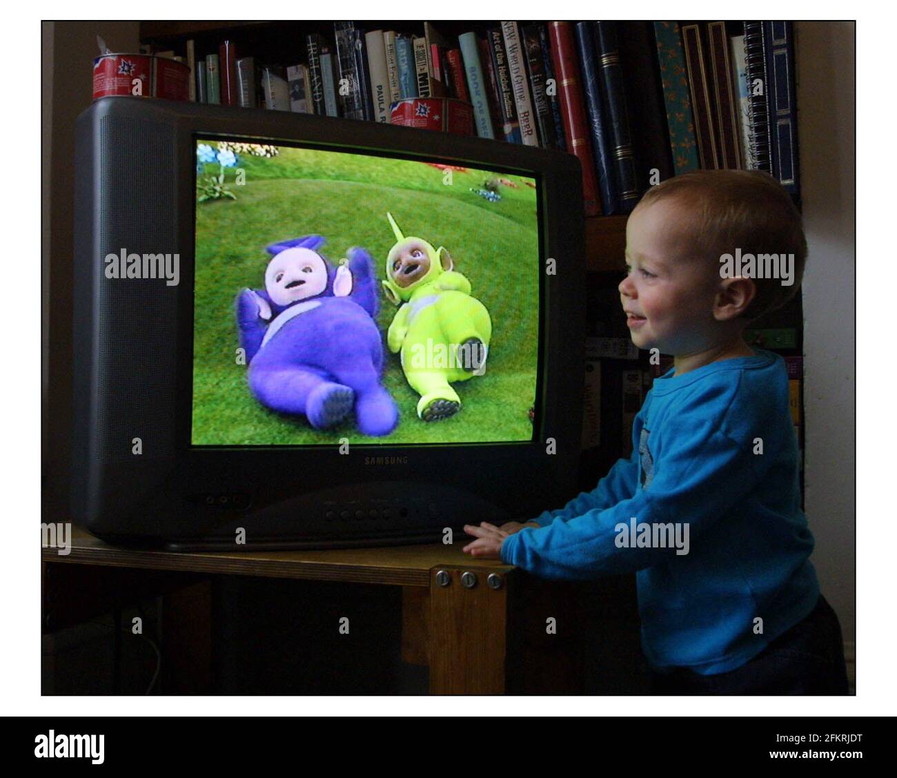 Oliver Bennett watching Tv with his son Bruno.pic David Sandison 30/10 ...