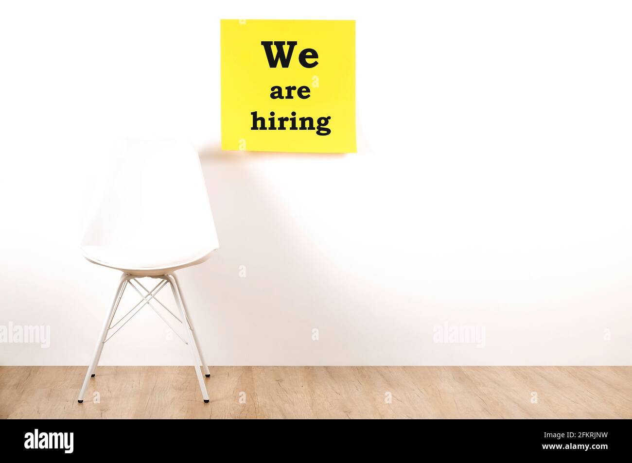 Job recruitment advertisement, WE ARE HIRING text written on yellow ...