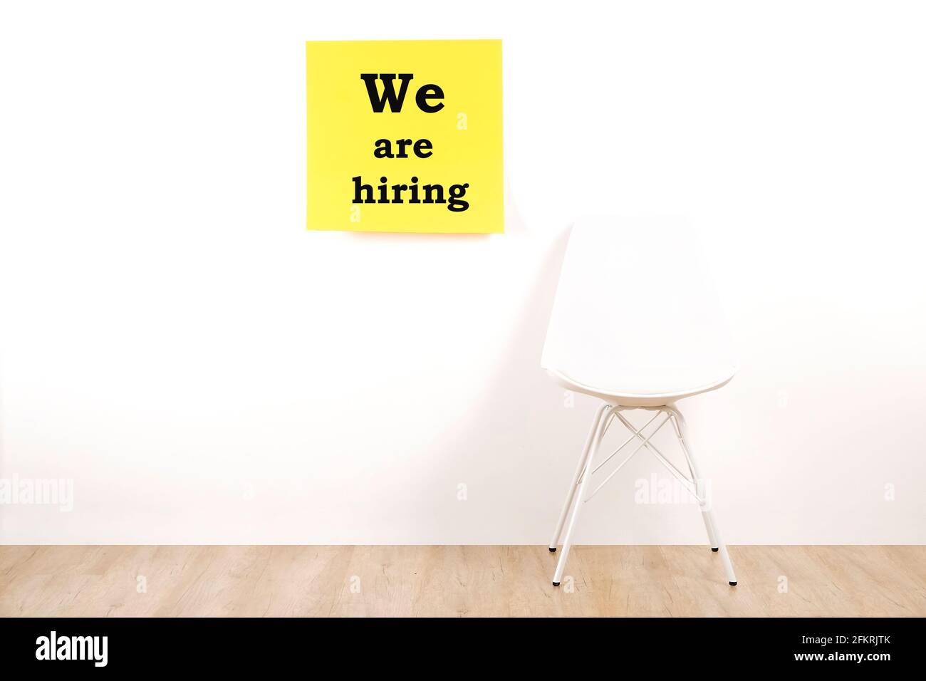 Job recruitment advertisement, WE ARE HIRING text written on yellow ...