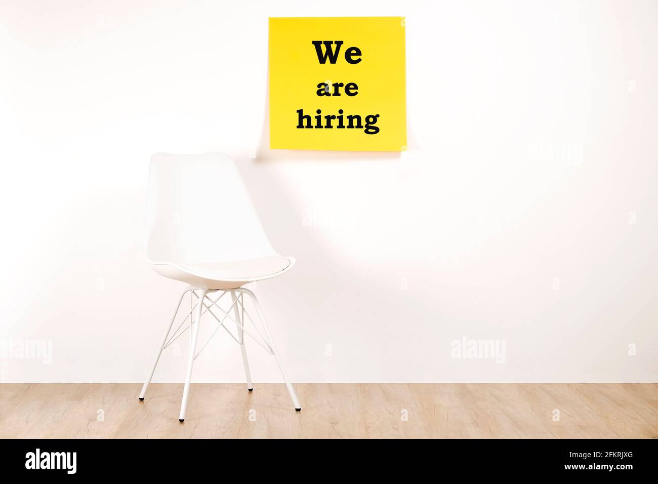 Job recruitment advertisement, WE ARE HIRING text written on yellow ...