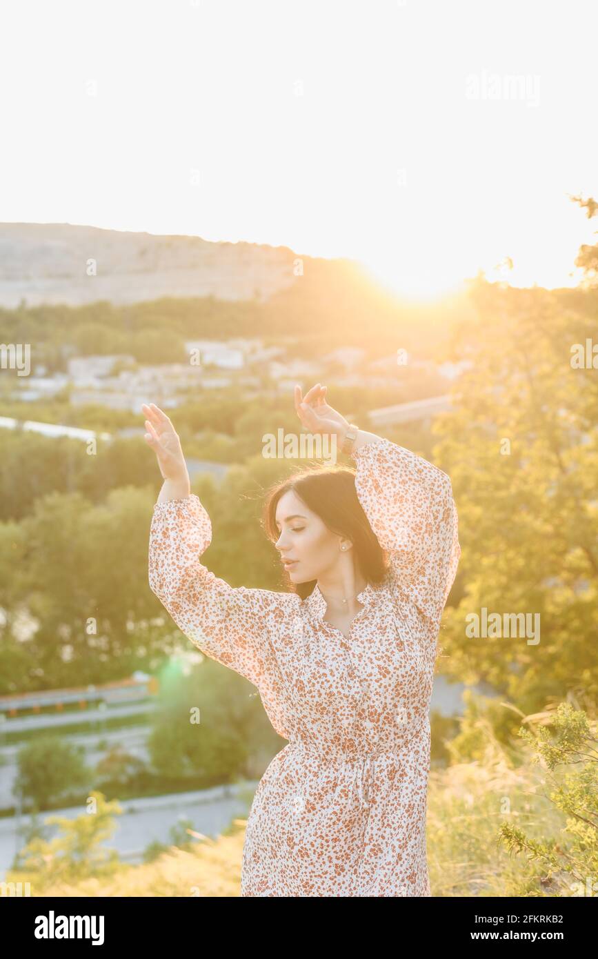 The young woman is catching the sun rays. The young woman is on the ...