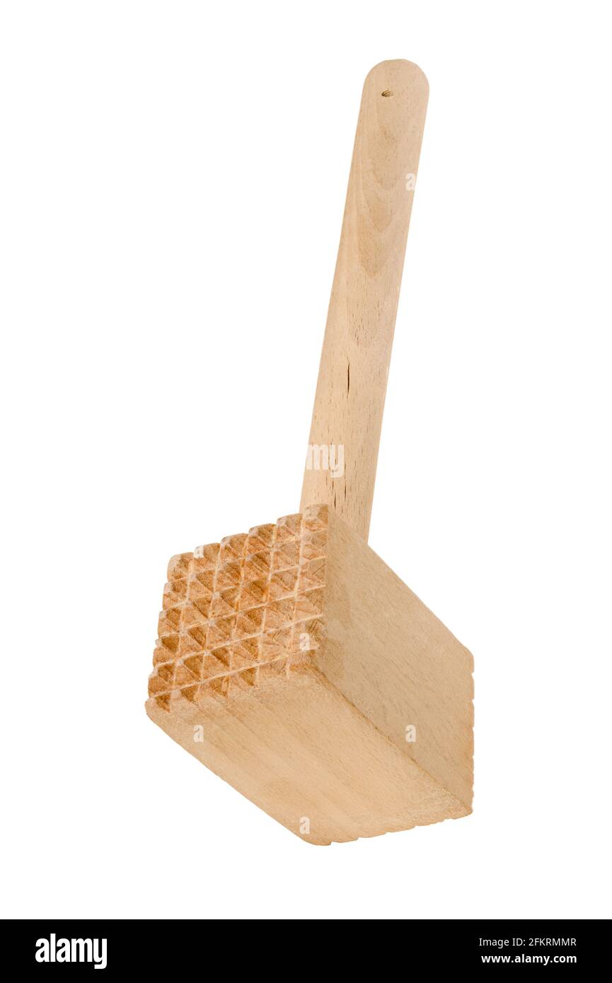 Wooden meat grinder on a chopping board. Wooden kitchen utensils on the ...