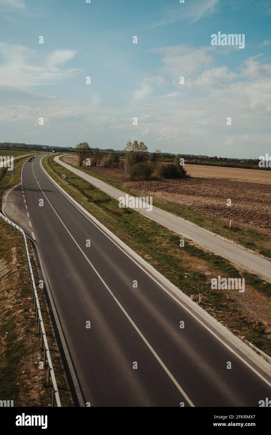 Vertical shot of an empty street in the countryside area Stock Photo ...