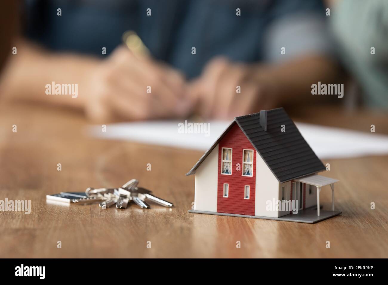 Close up of house model and keys in relator office Stock Photo - Alamy